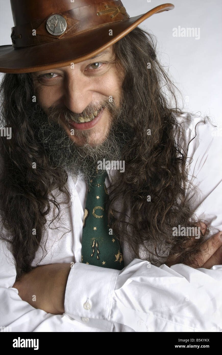 Long haired man with leather hat Stock Photo - Alamy