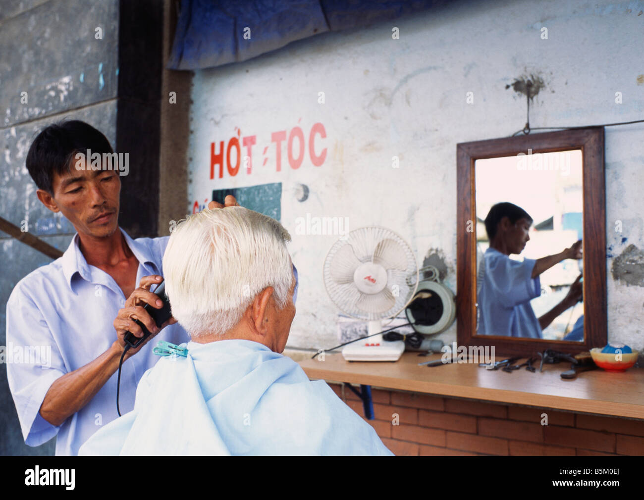 street haircut, Hanoi, Vietnam Stock Photo - Alamy