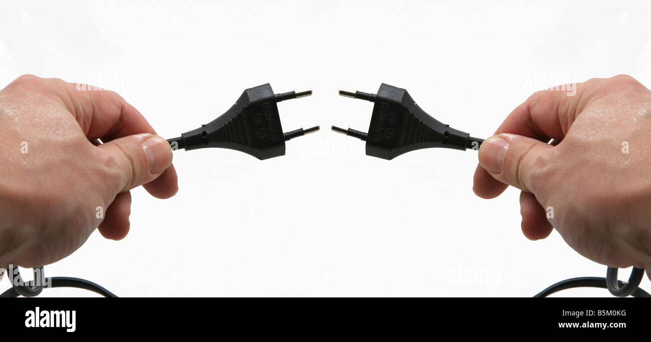 hand holding an electrical plug Stock Photo - Alamy