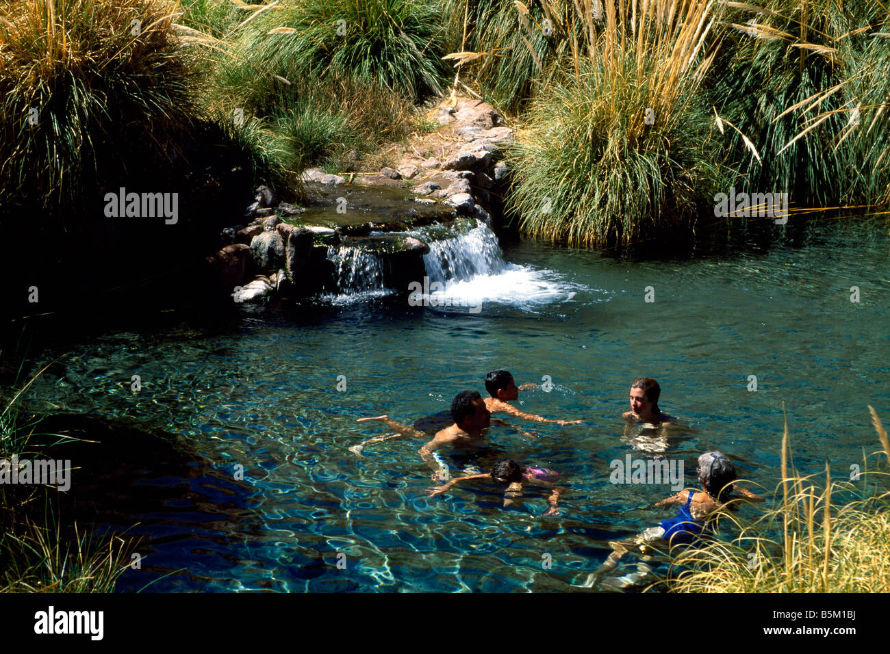 Group of people enjoying a bath at Bagnos de Puritama San Pedro Chile ...