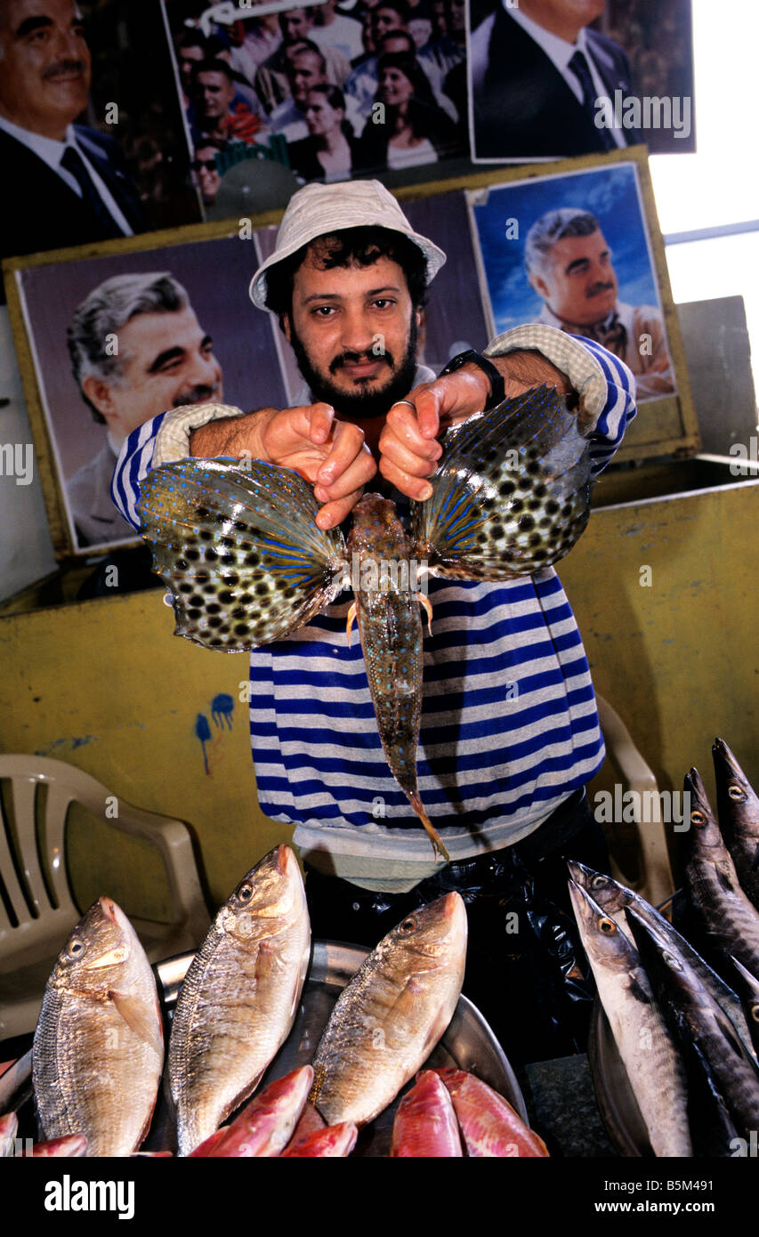 A fishmonger in Sidon, Lebanon, shows off his produce which includes a ...