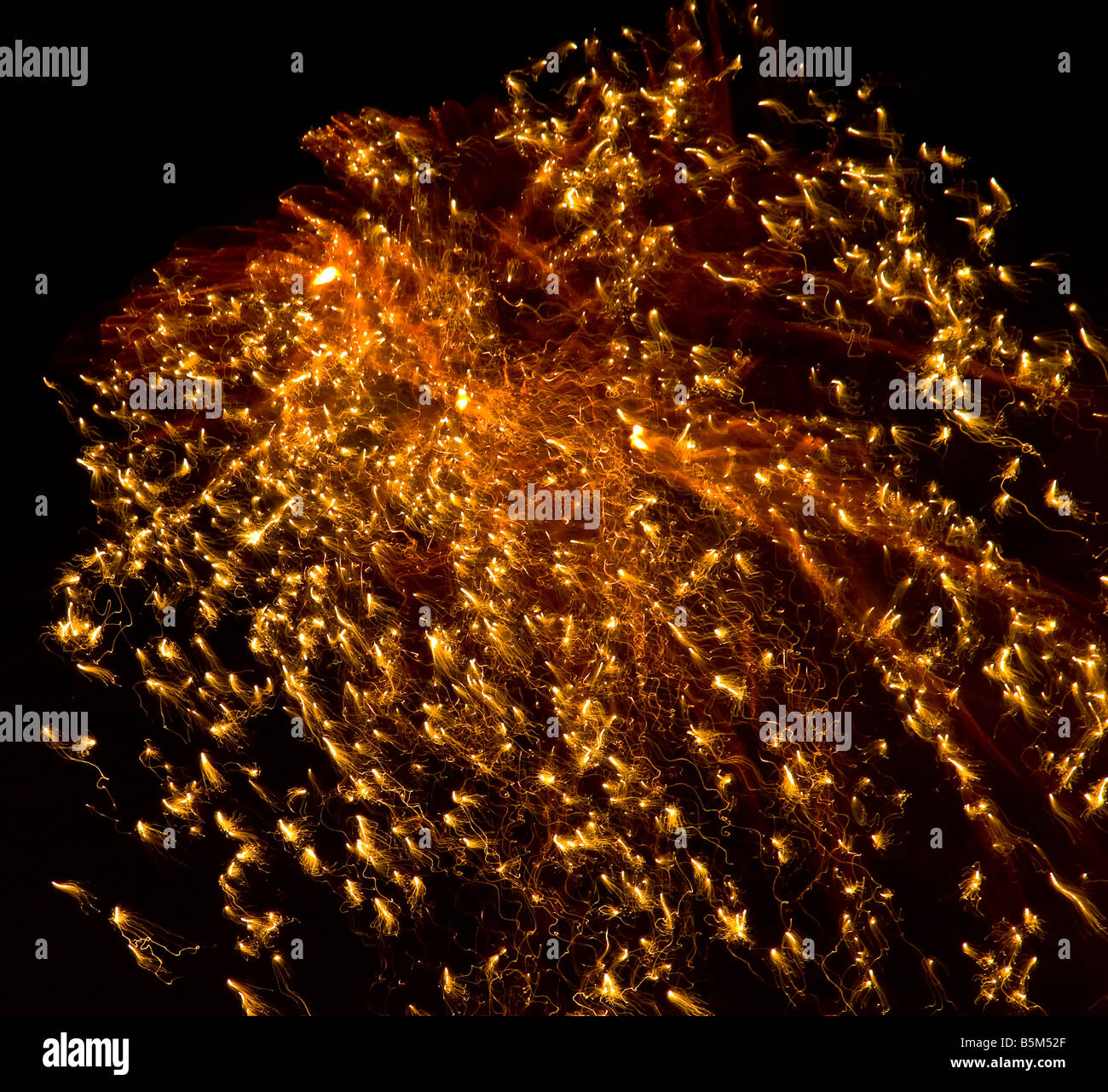 Firecrackers exploding against a dark night sky Stock Photo - Alamy