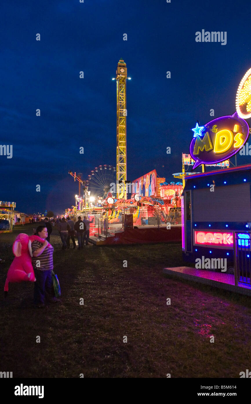 A young girl at a fun fair (specifically at 'The Hoppings' annual fair ...