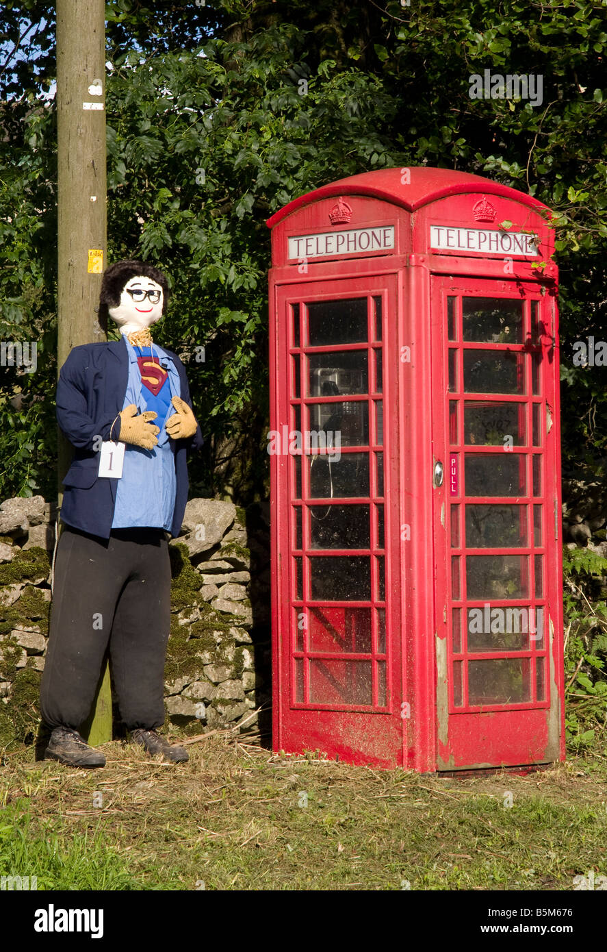 superman scarecrow with traditional red english telephone box in the ...