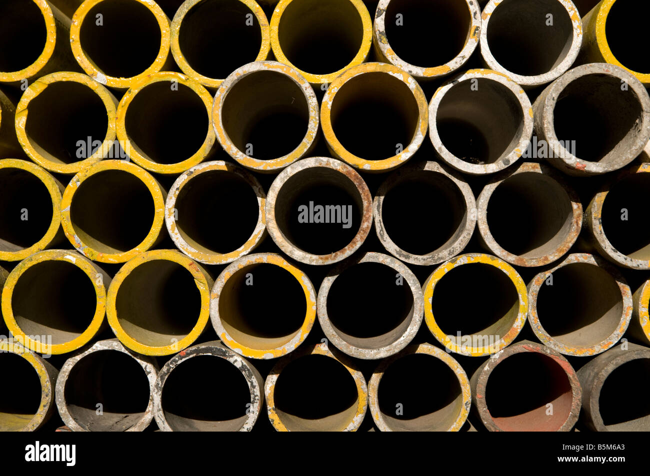 Stack of scaffolding poles UK Stock Photo - Alamy
