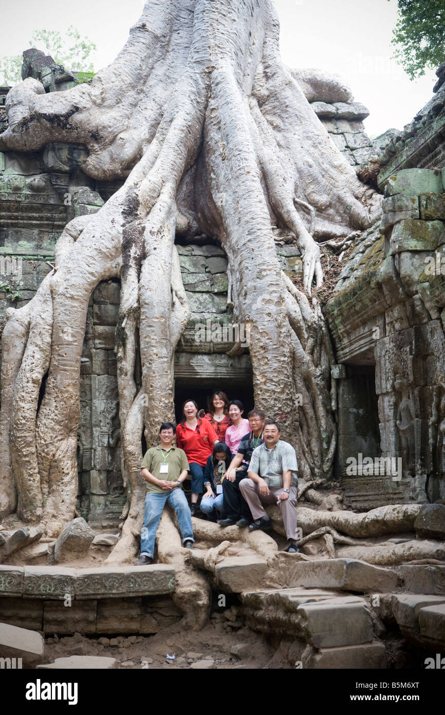 Visitors inside the overgrown temple of Ta Prohm Temples of Angkor Siem Reap Cambodia Stock ...