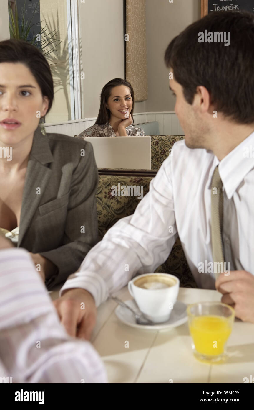 A flirtatious smile from across the booth Stock Photo - Alamy
