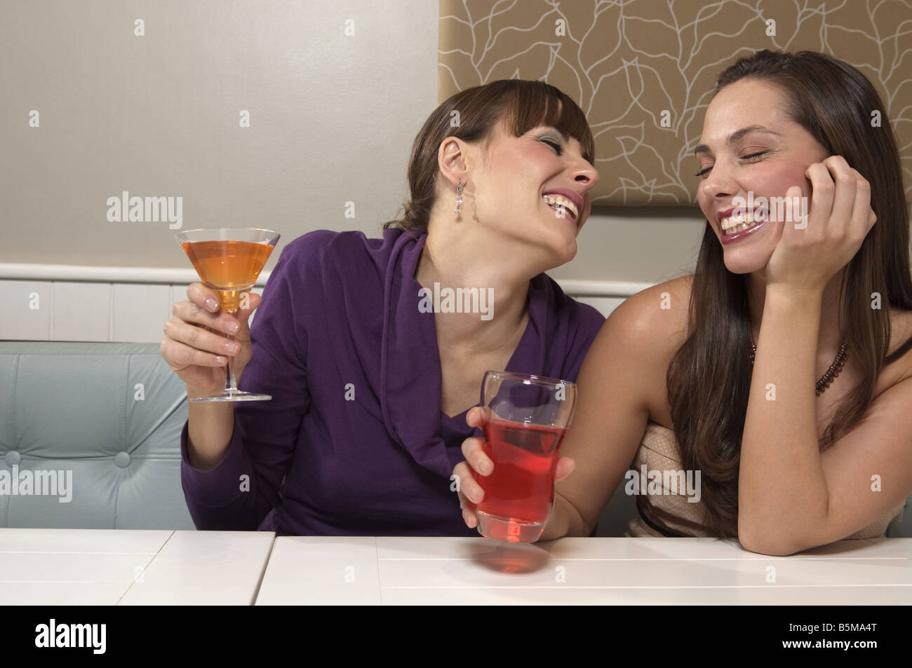 Two women having drinks Stock Photo - Alamy