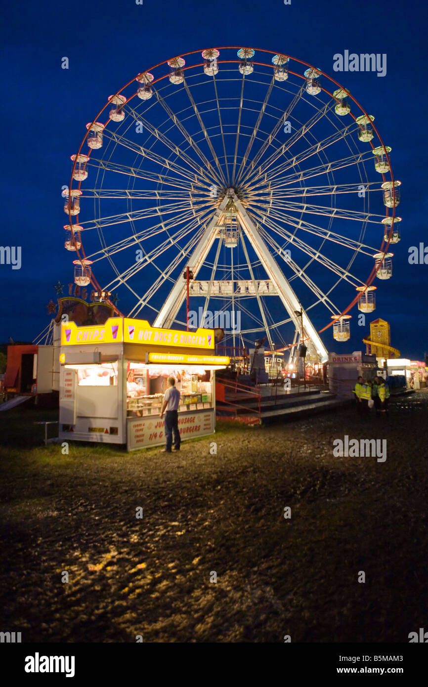 A ferris wheel at a fun fair (specifically 'The Hoppings' annual fair ...