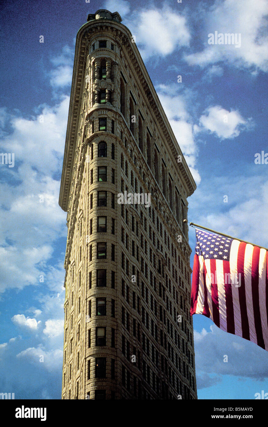 New York City The Flatiron Building (Fuller Building) and American flag ...