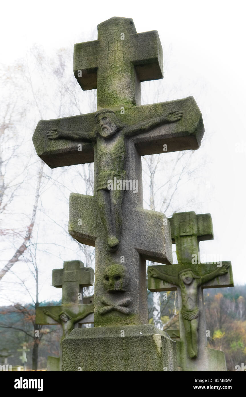 3 stone crosses with Jesus figure with skull and crossbones Stock Photo ...