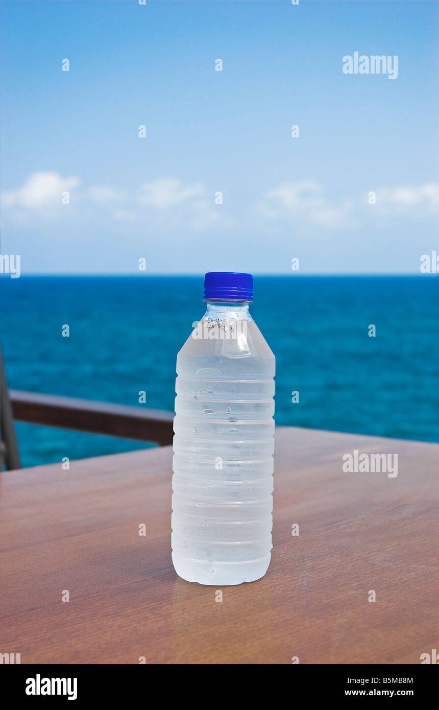 Bottle of water on table Stock Photo - Alamy