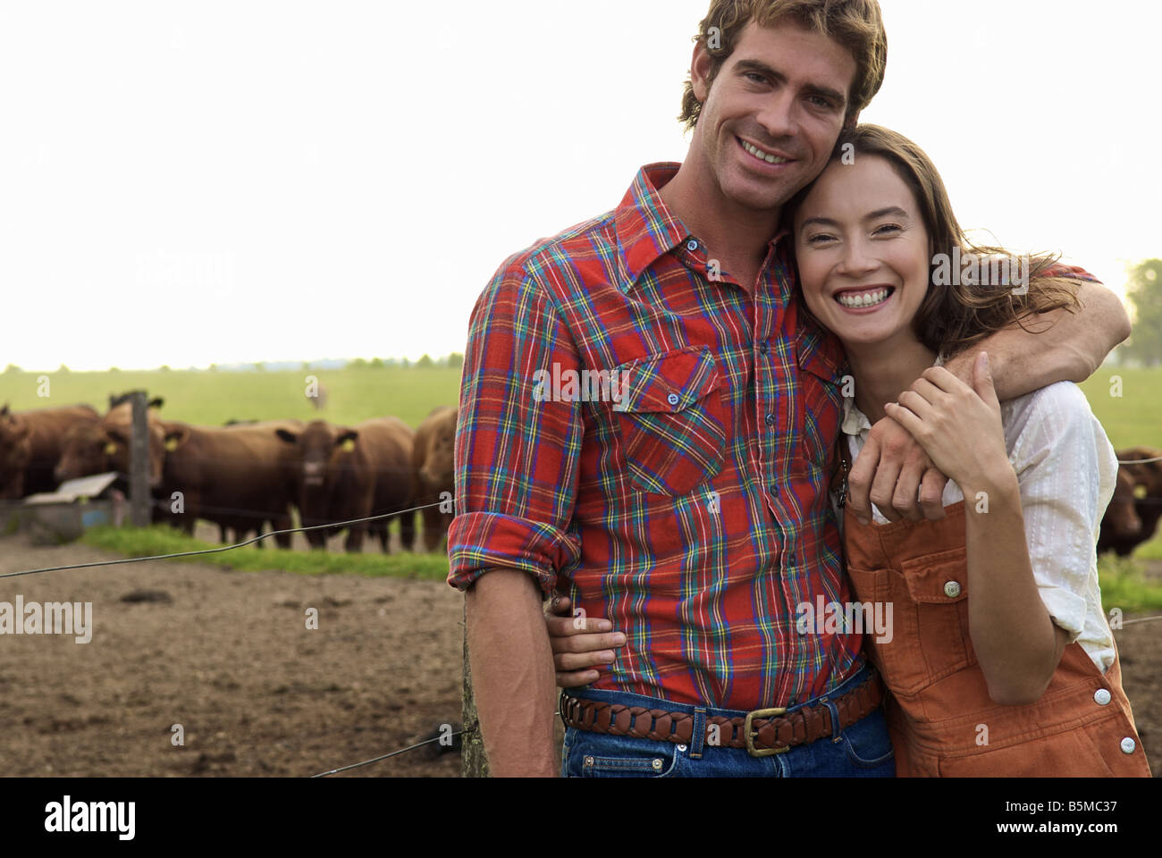 A young couple on a ranch Stock Photo - Alamy
