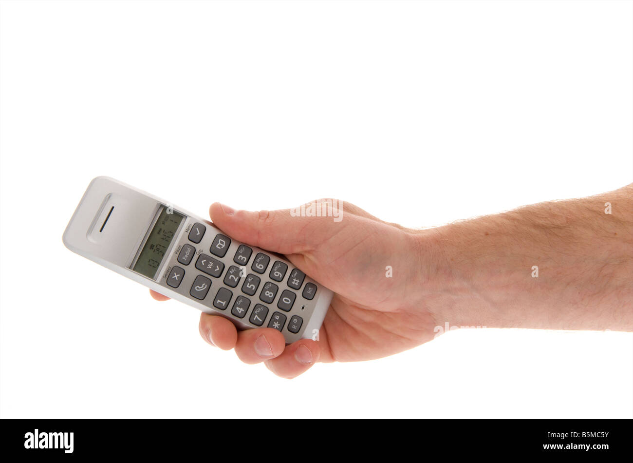 mans male right outstretched hand holding a cordless digital phone ...