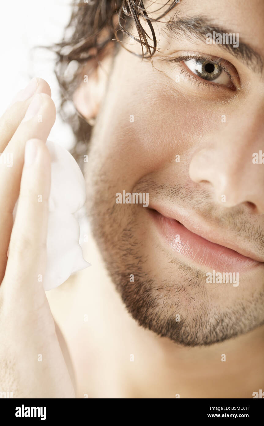 A man about to apply shaving cream on his face Stock Photo - Alamy