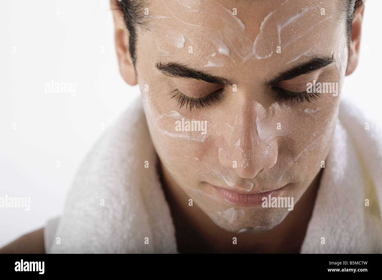 A man with lotion on his face Stock Photo - Alamy