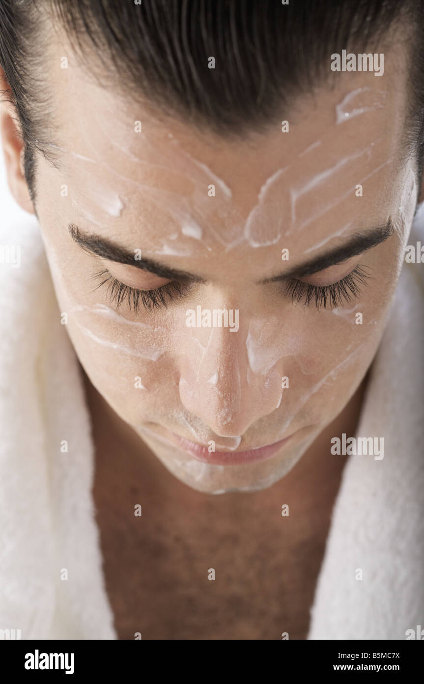 A man with lotion on his face Stock Photo - Alamy