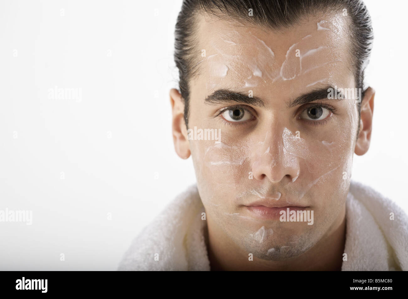 A man with lotion on his face Stock Photo - Alamy