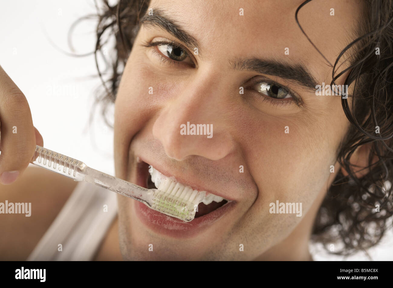 A man brushing his teeth Stock Photo - Alamy