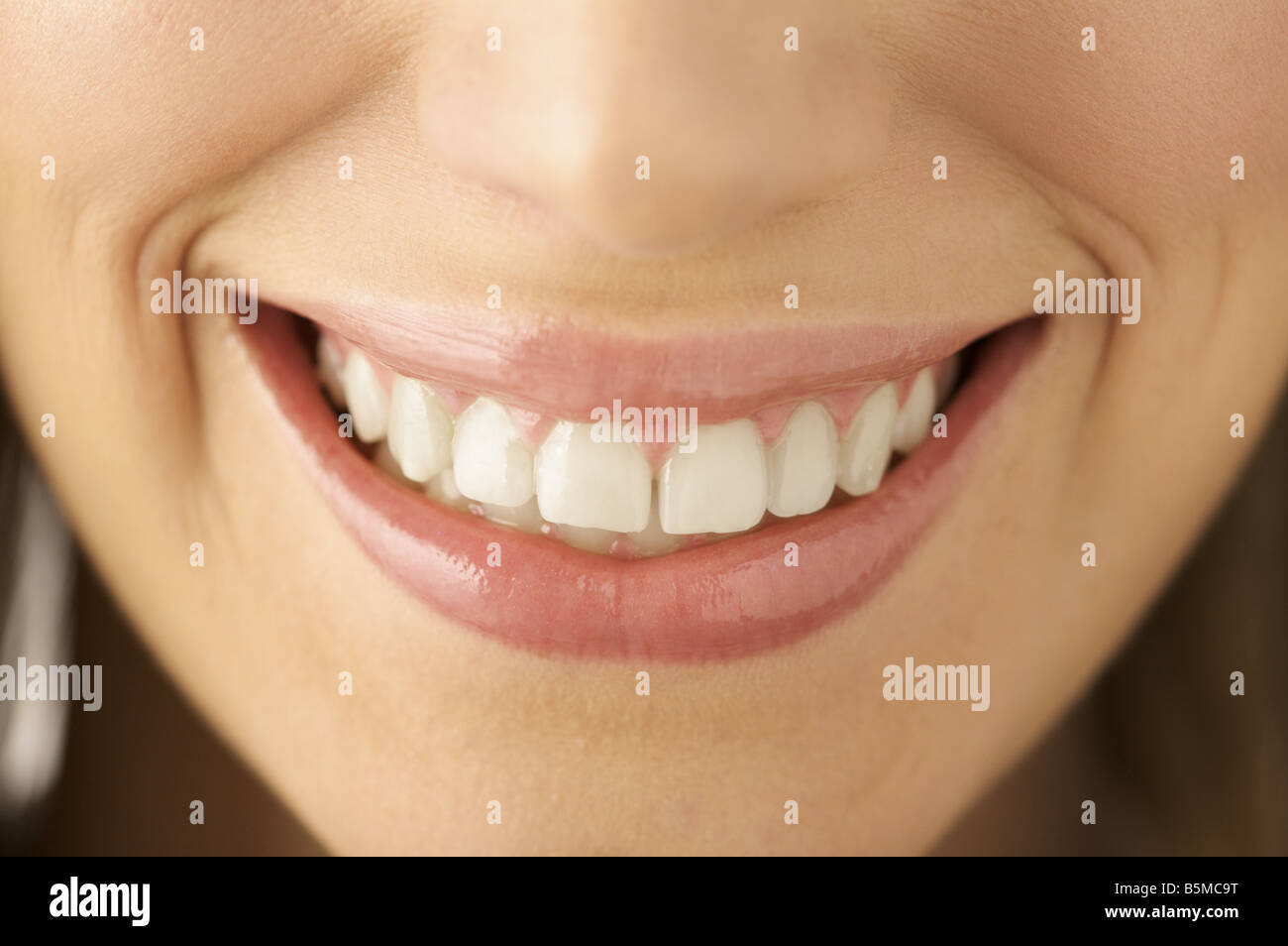 A smiling woman's mouth Stock Photo - Alamy