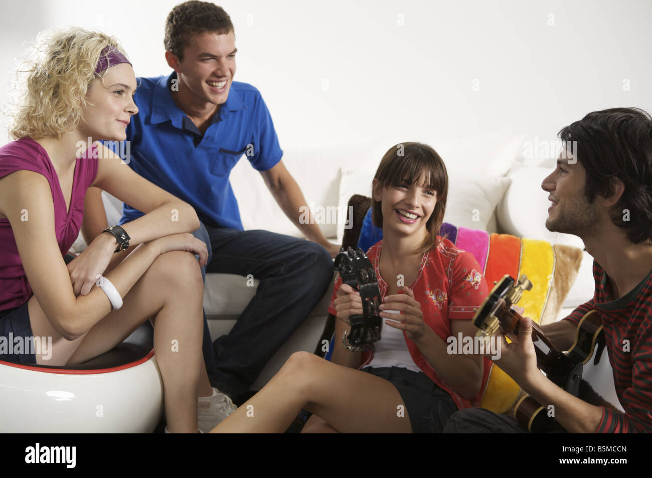 A small group of teenagers playing musical instruments Stock Photo - Alamy