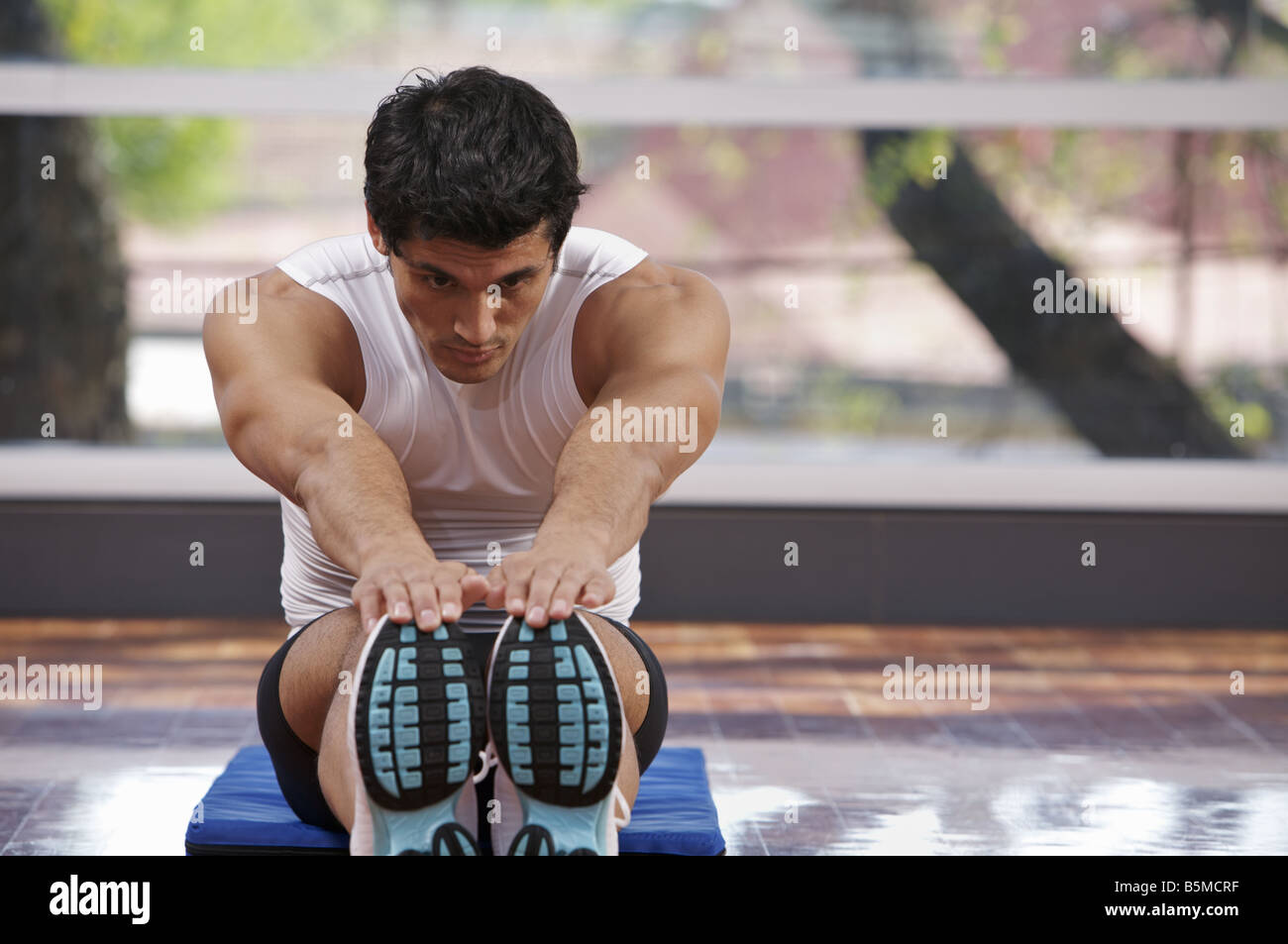 A man stretching Stock Photo - Alamy