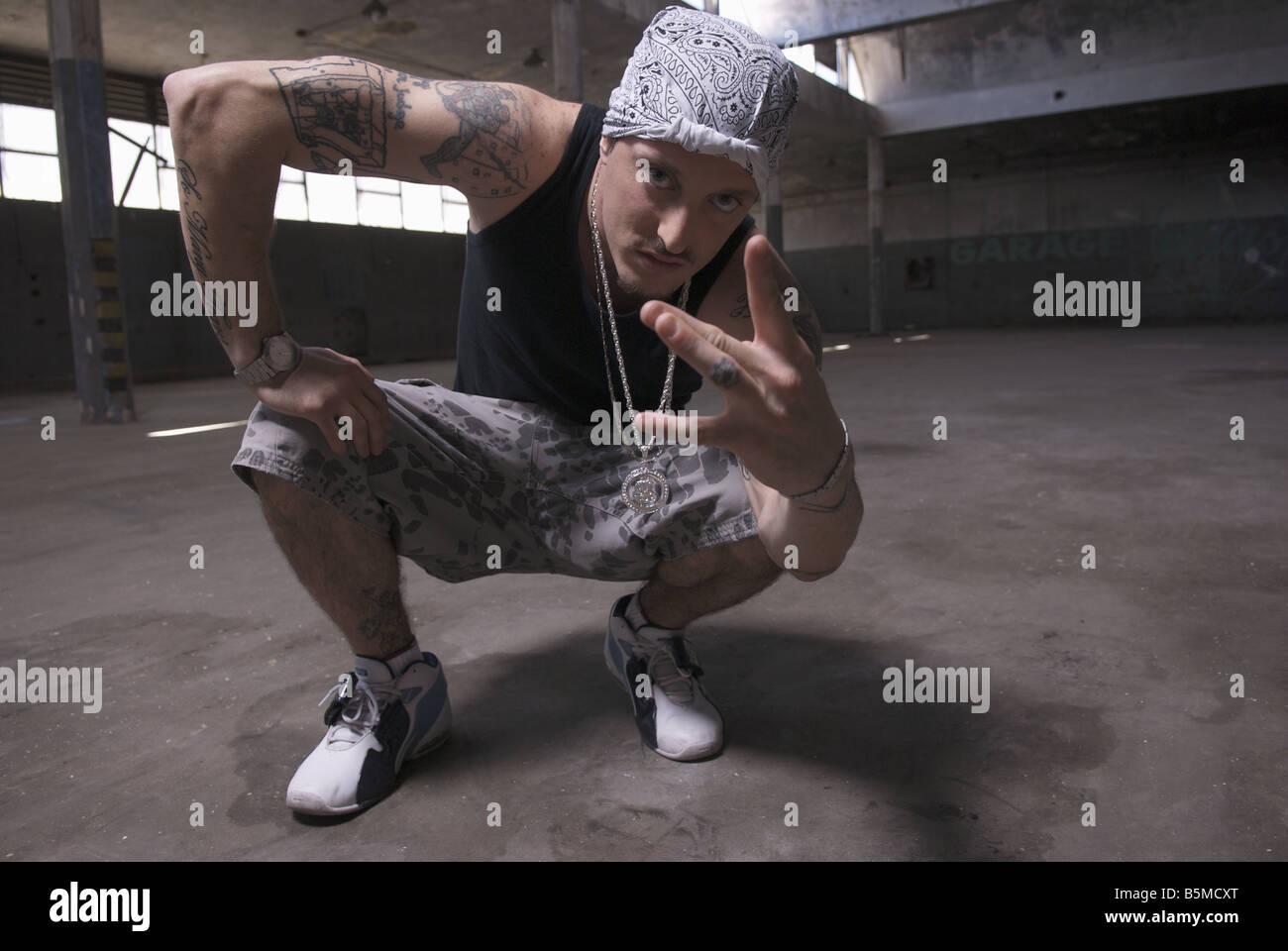 A young man making hand signs Stock Photo - Alamy