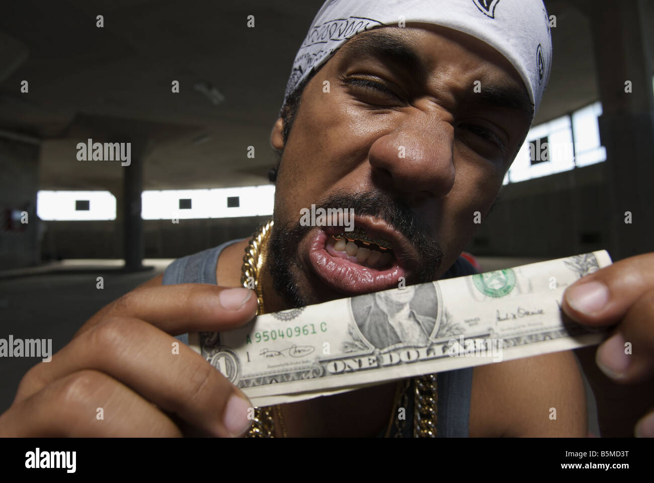 A young man with a dollar bill Stock Photo - Alamy