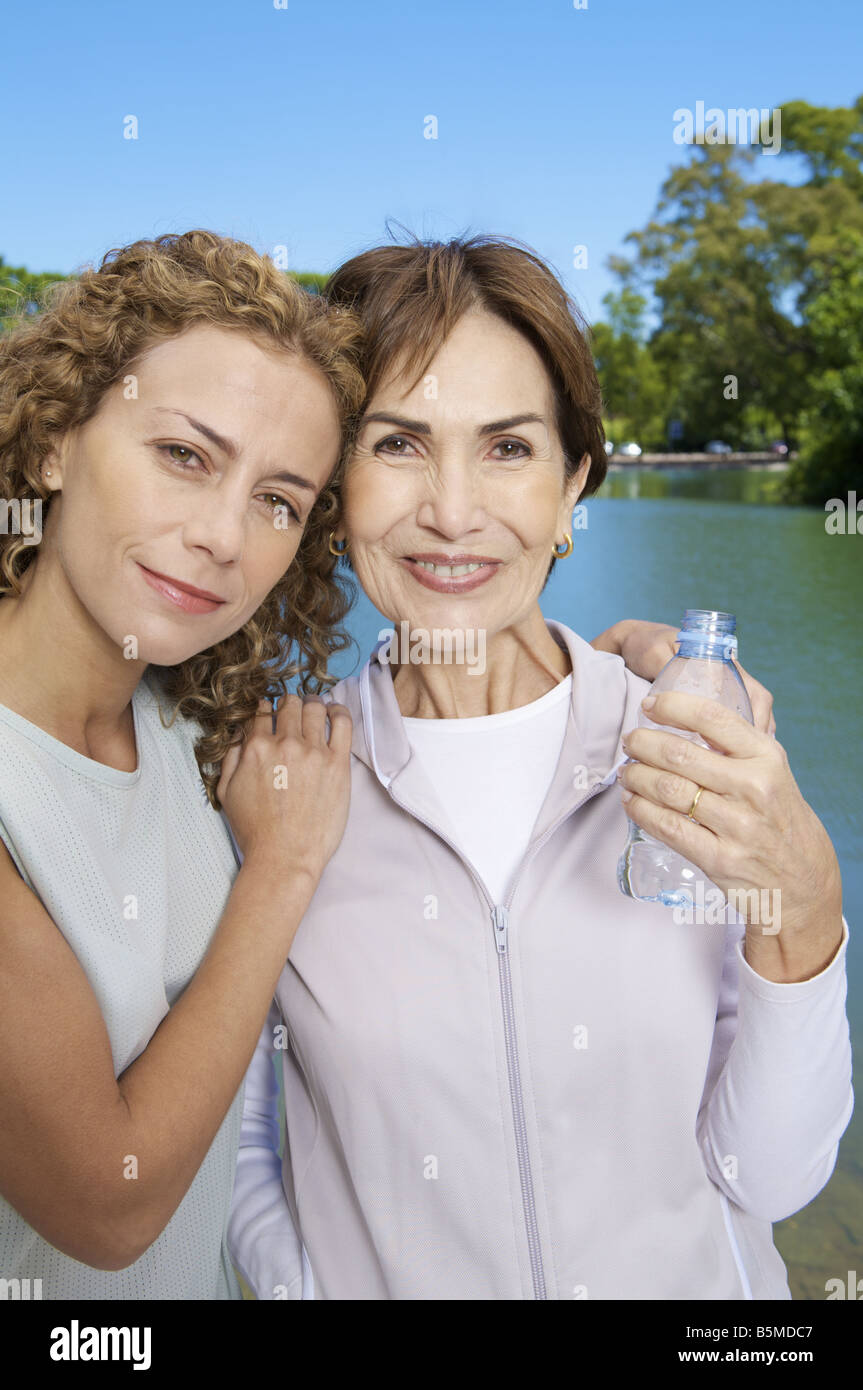Two women hugging Stock Photo - Alamy