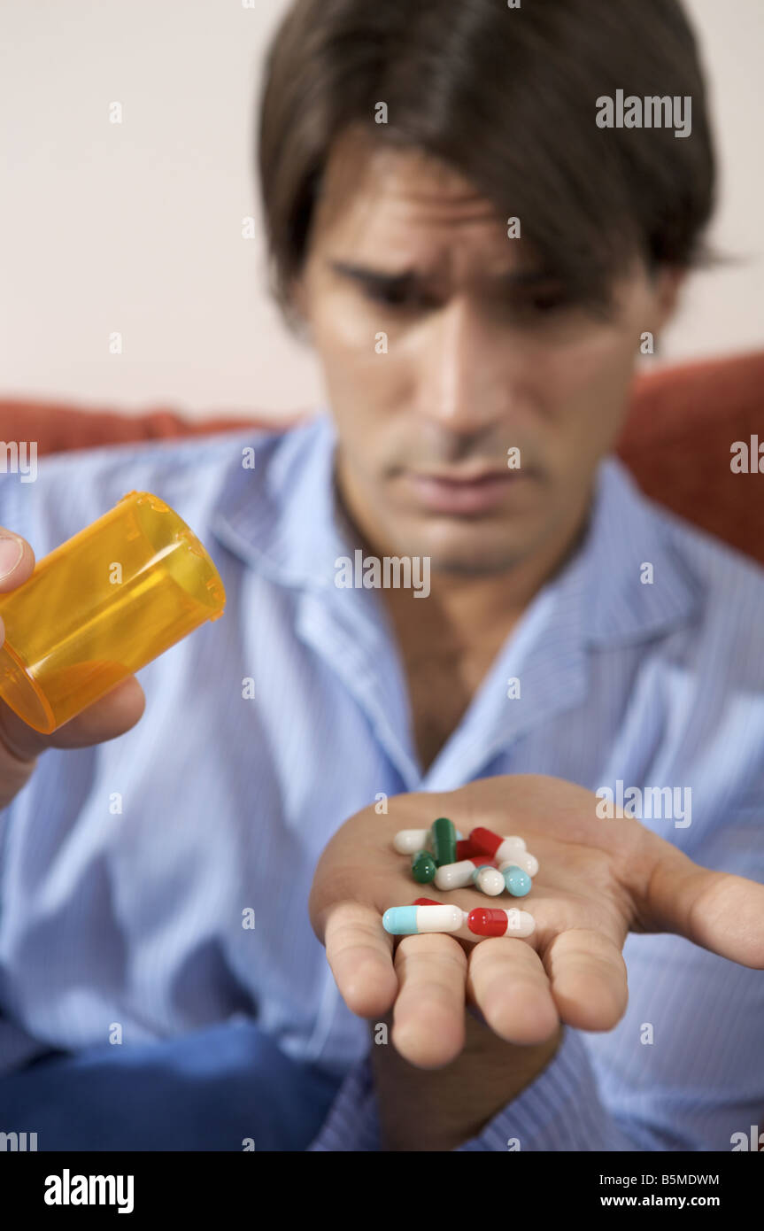 Hand full pills hi-res stock photography and images - Alamy