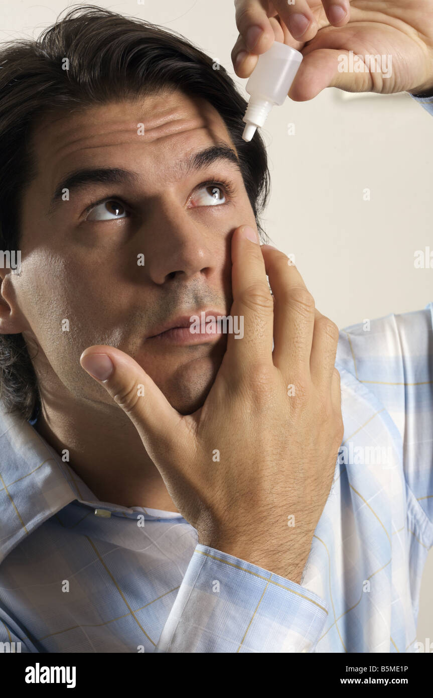Putting eye drops into eyes hi-res stock photography and images - Alamy