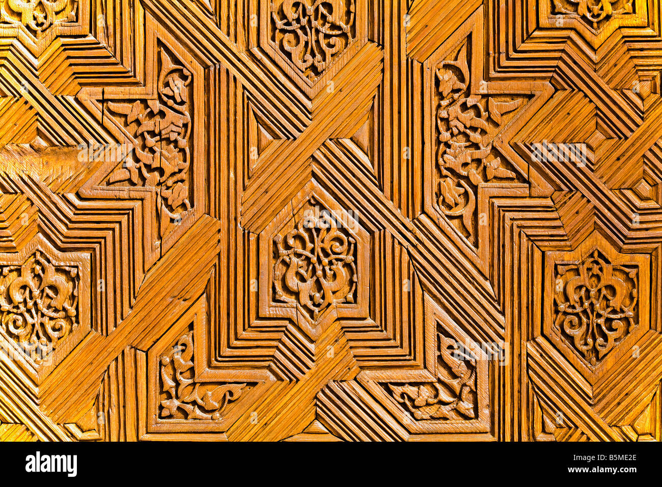 Close up of wall with arabesque patterns in La Alhambra, Granada, Spain ...