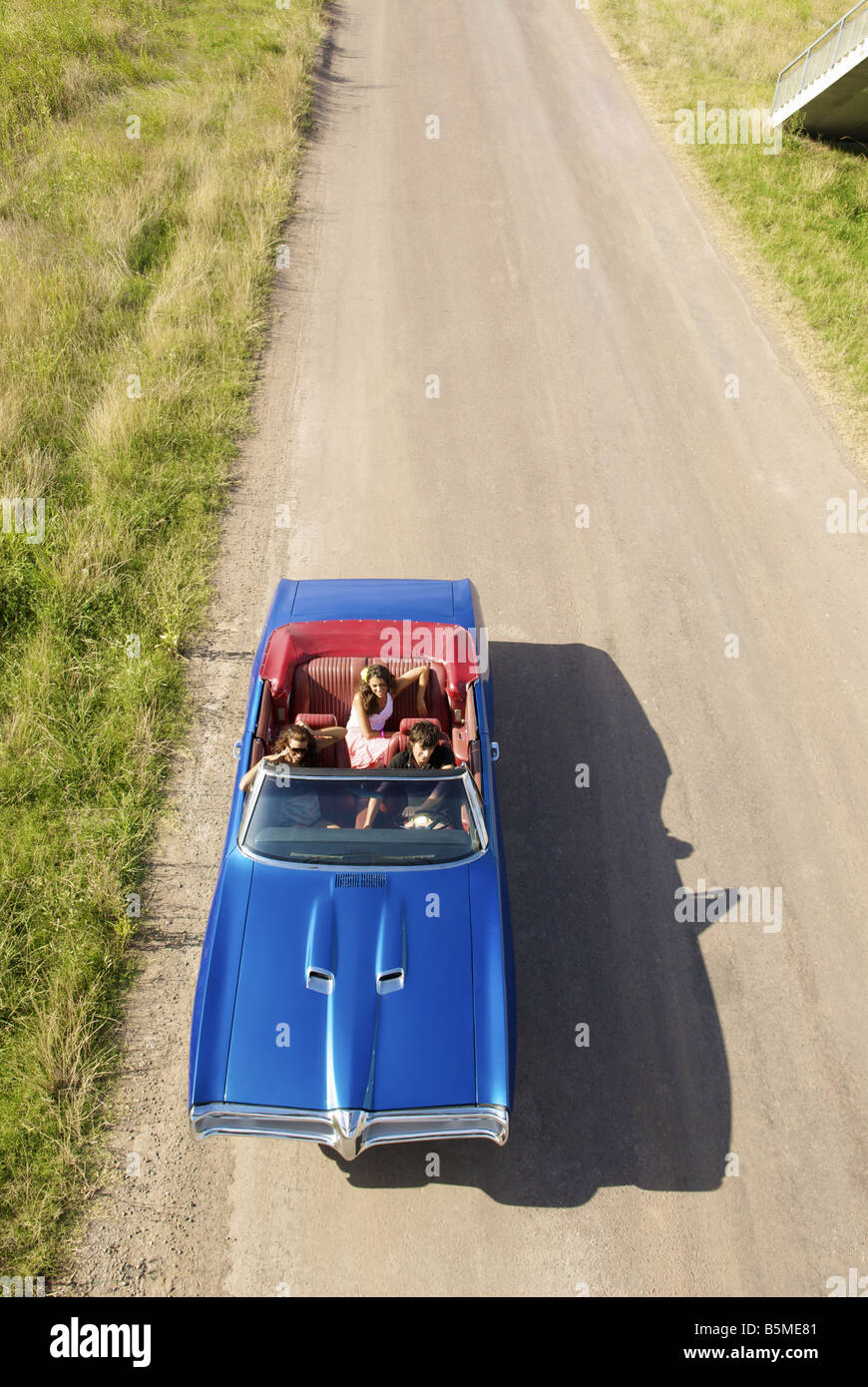 A small group of people riding in a car Stock Photo - Alamy
