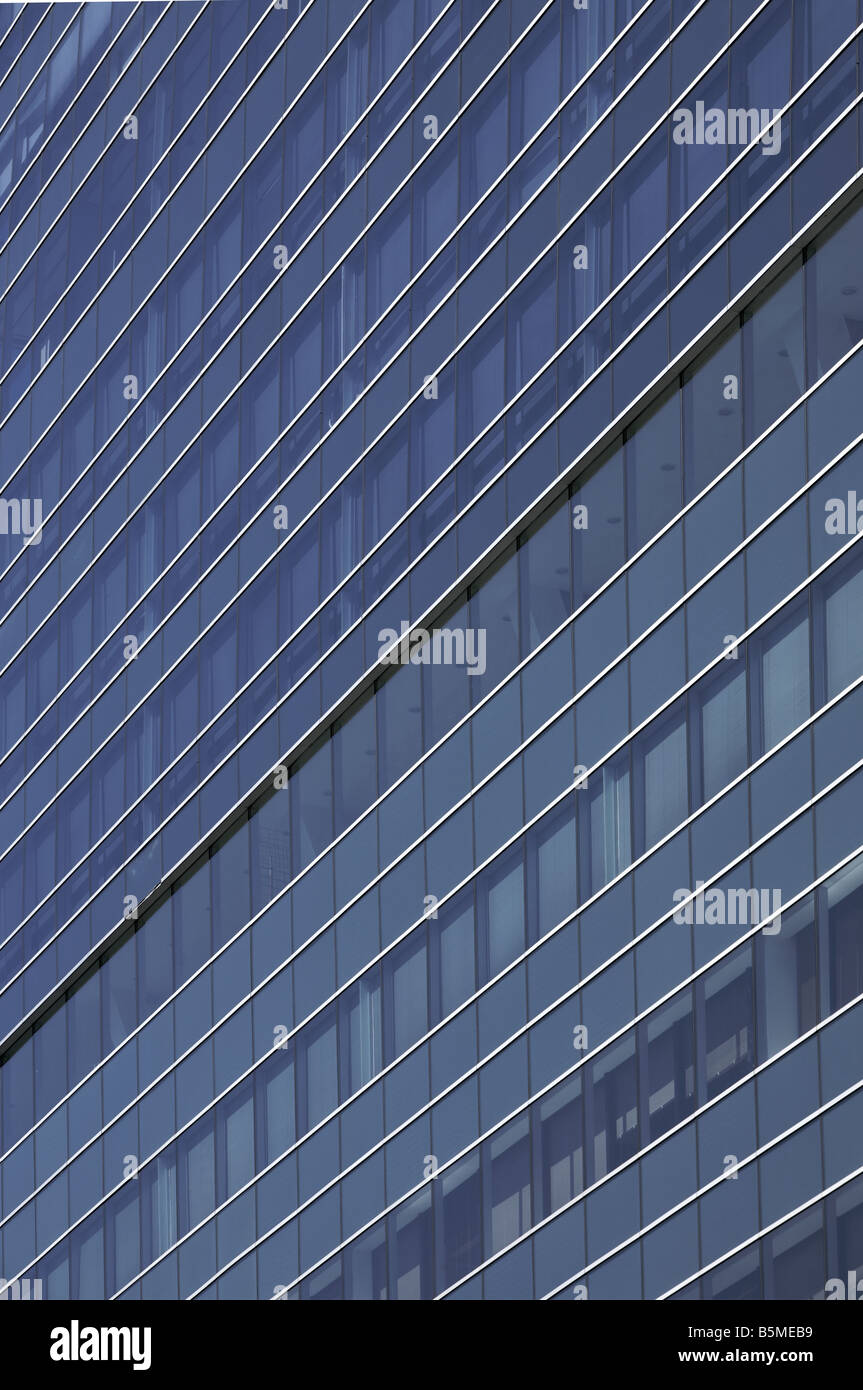 The side of a building covered with reflective glass windows Stock ...