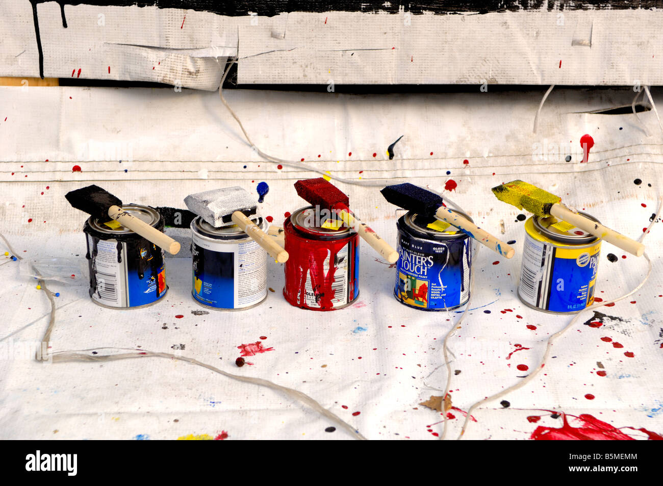 Paint cans at an outdoor art event Stock Photo - Alamy