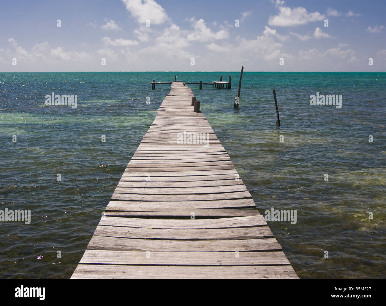 CAYE CAULKER BELIZE Weathered wooden dock by Caribbean sea Stock Photo ...