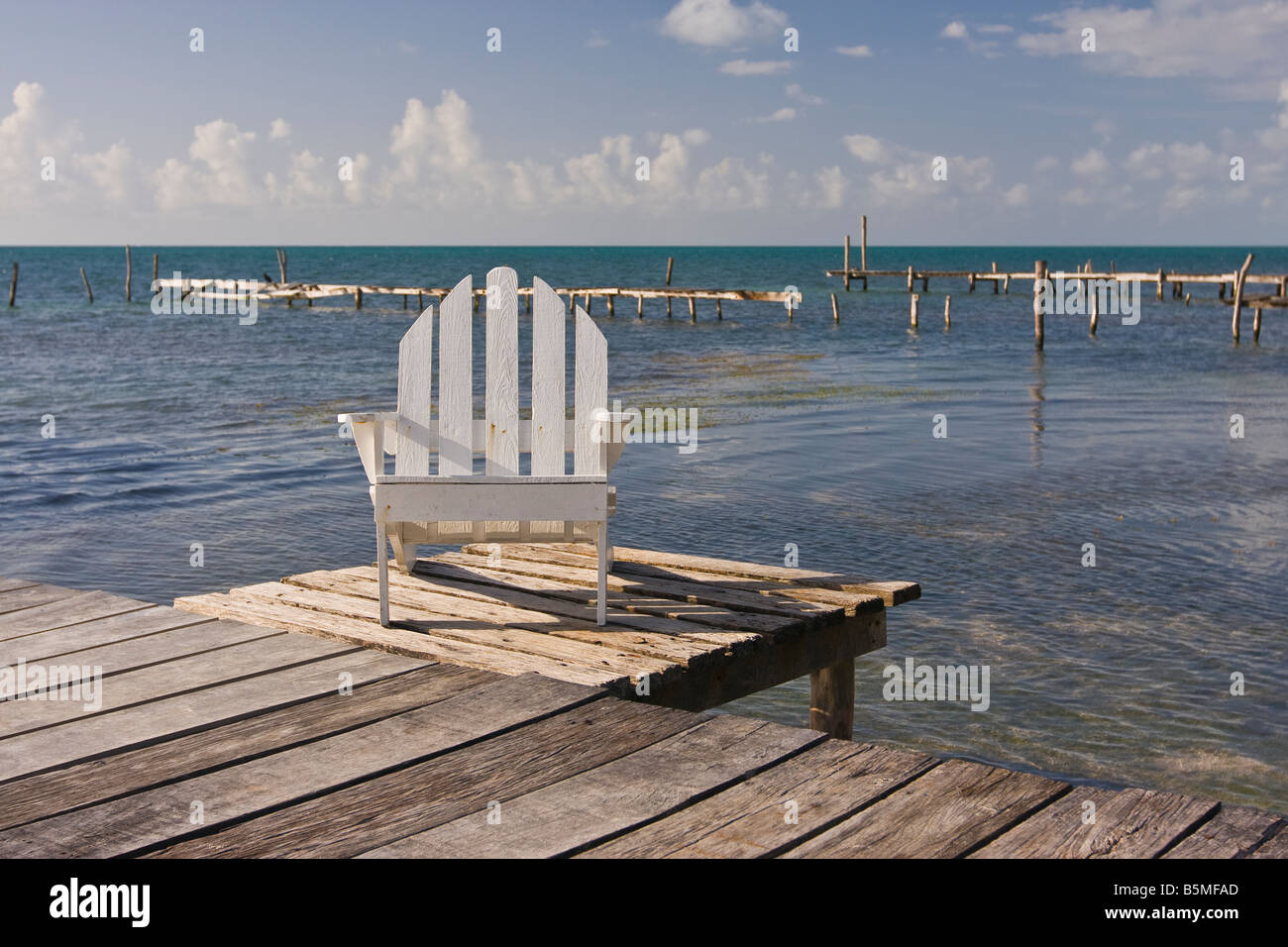 CAYE CAULKER BELIZE Chair on dock Stock Photo - Alamy