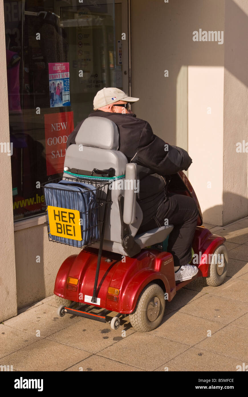 Old man on mobility scooter hi-res stock photography and images - Alamy