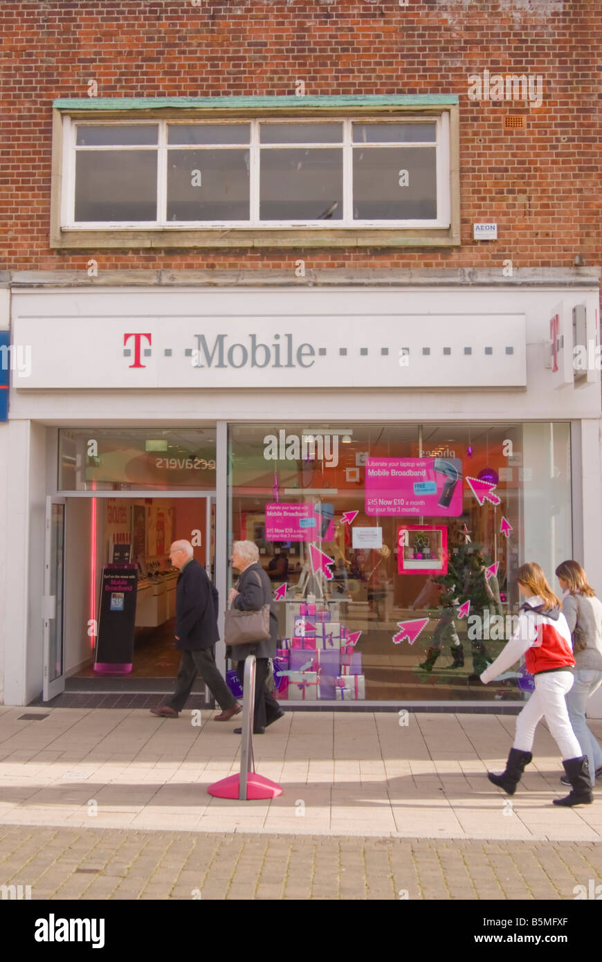 T Mobile phone shop selling mobiles and broadband with people walking ...