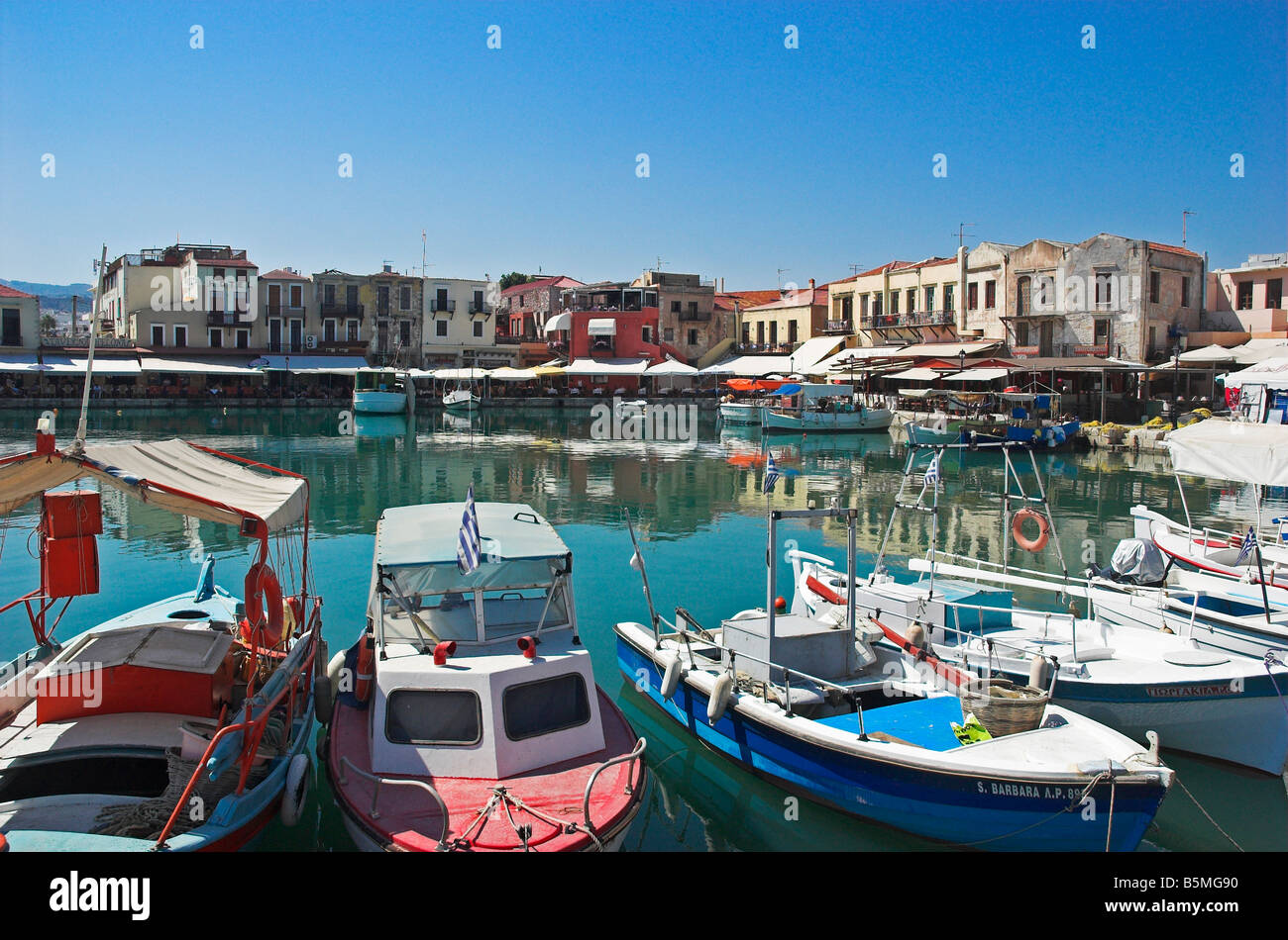 Venetian harbour with colorful fishing boats in Rethymno Crete Greece ...