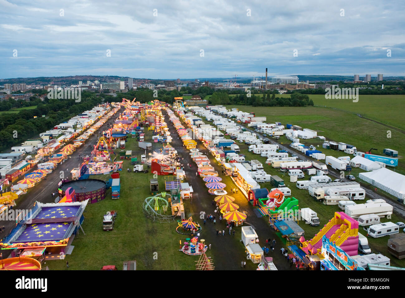 Looking down on a sprawling funfair (specifically at 'The Hoppings ...