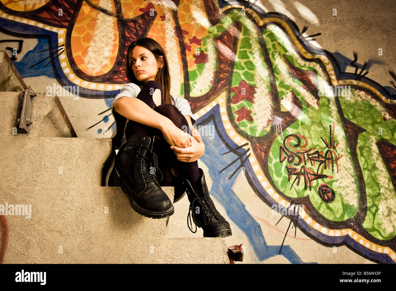 Rebel young girl posing in her hiding place Stock Photo - Alamy