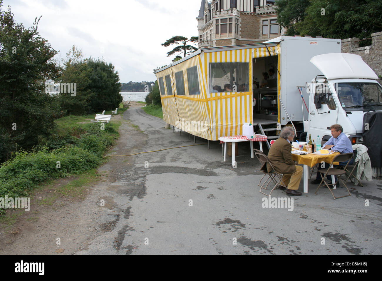 people eating at a roadside catering van Stock Photo - Alamy