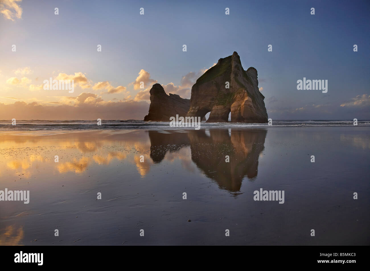 Archway Islands Reflected in Wet Sands of Wharariki Beach at Sunset near Cape Farewell NW Nelson ...