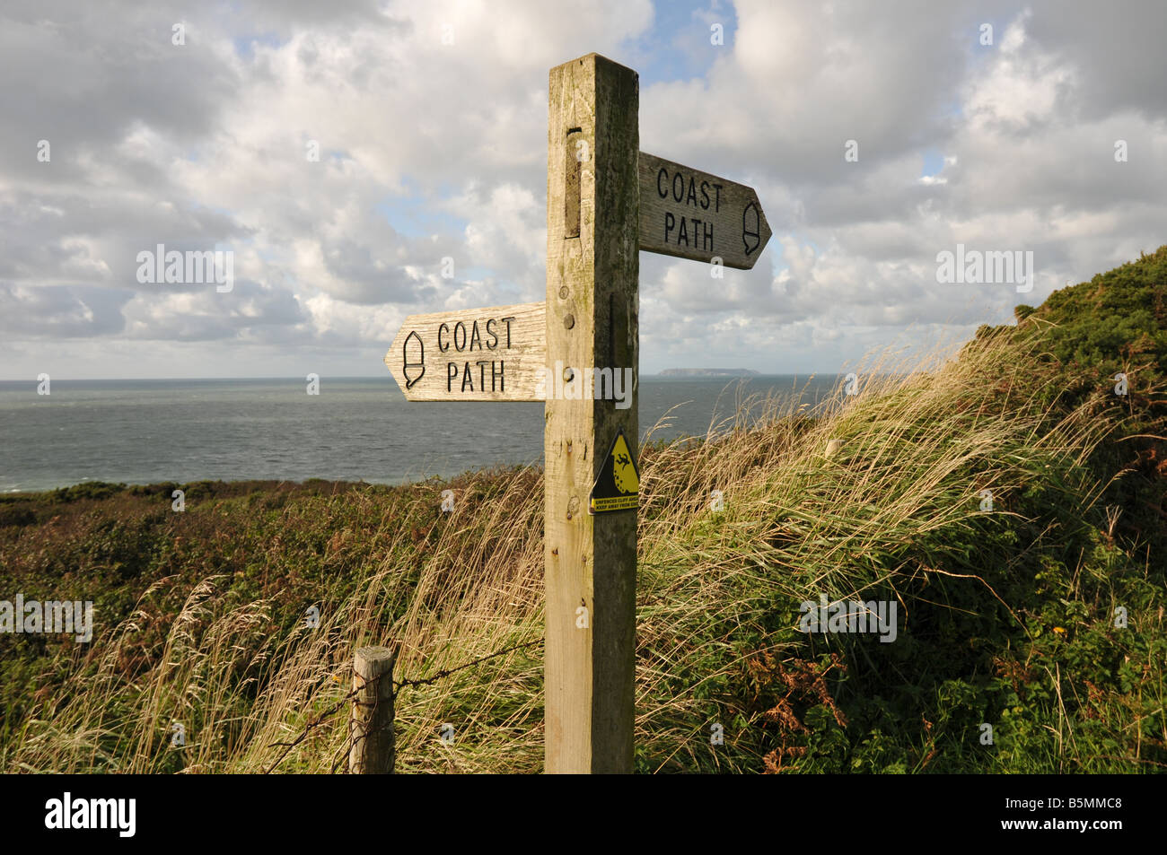 A South West Coastal Path sign near Hartland Point in North Devon. In ...
