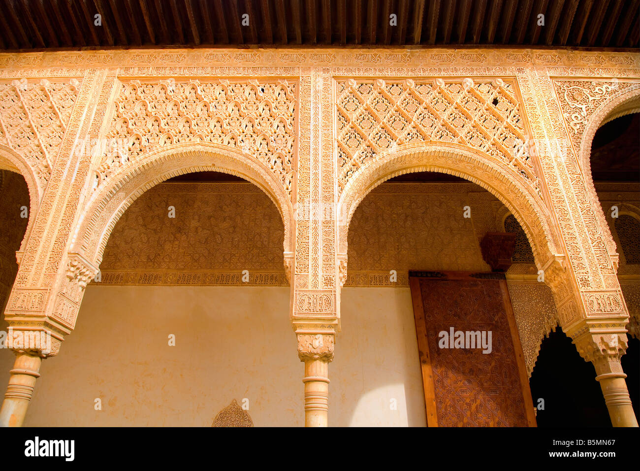 Arched walkways of the Patio de los Leones (Patio of the Lions) in La ...