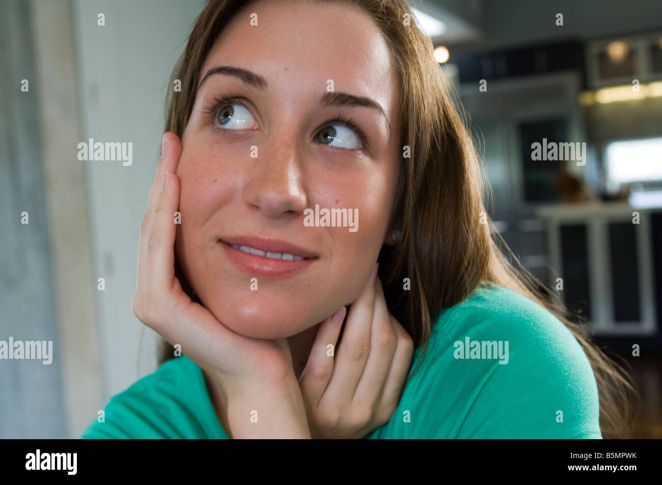 Teenage girl thinking dreamily Stock Photo - Alamy