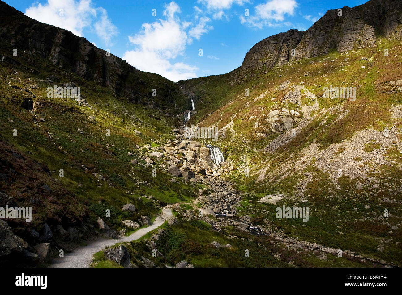Sunbursts falling on the Mahon Falls, Comeragh Mountains, County ...