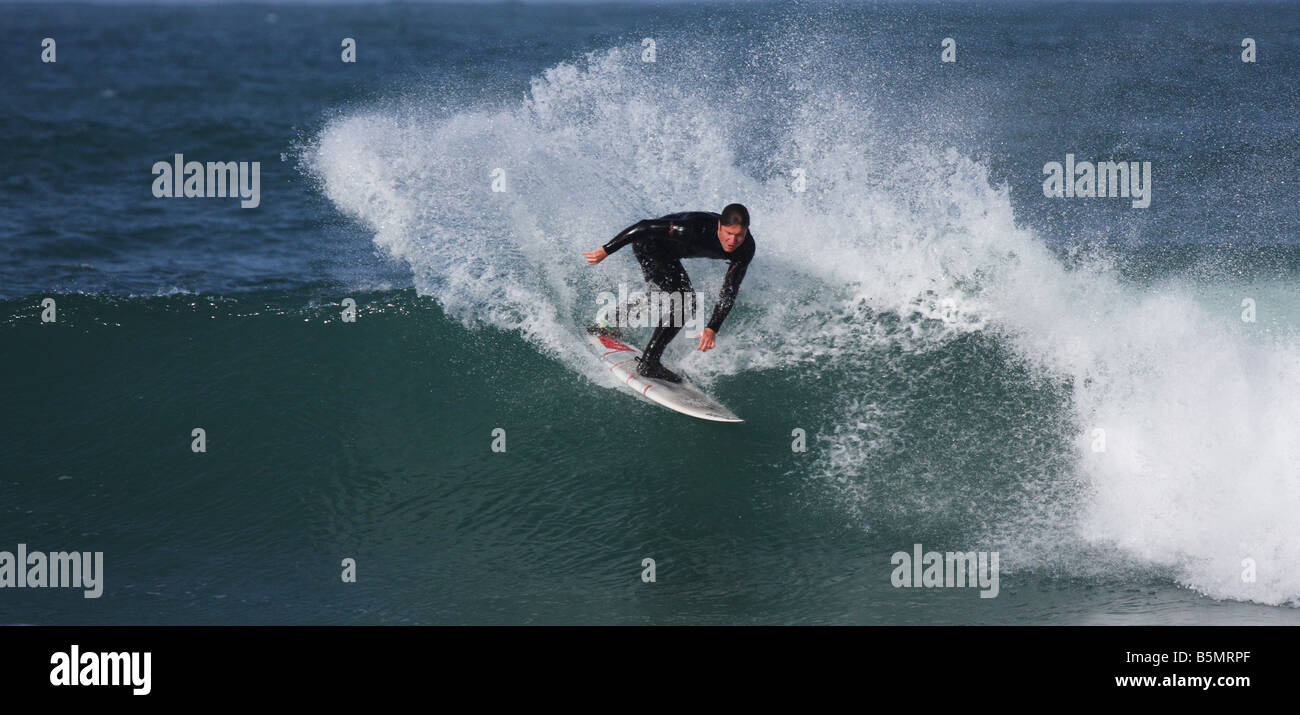 Surfing the Waves at Newquay Cornwall an extreme sport Stock Photo - Alamy