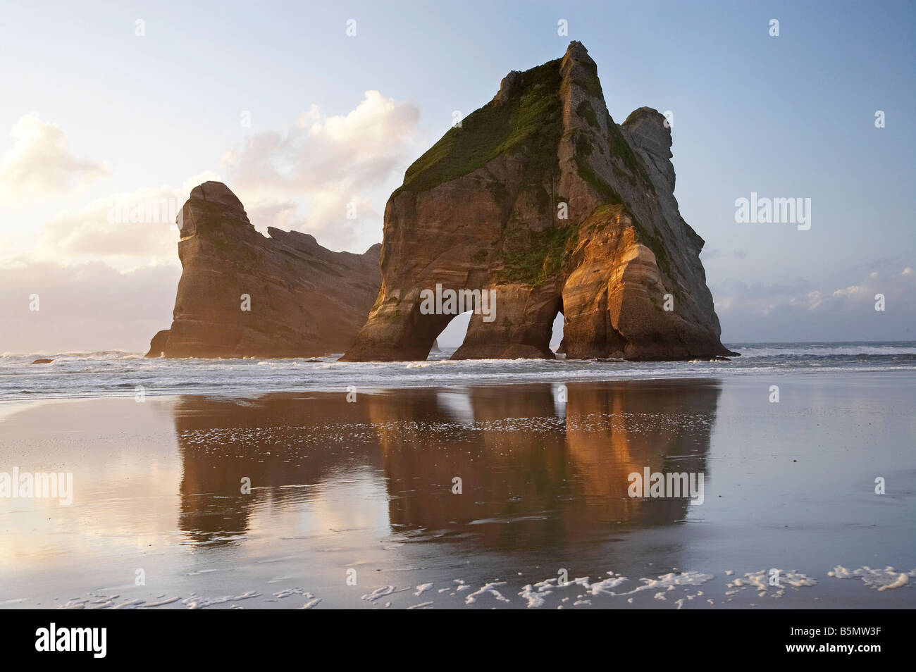 Archway Islands Reflected in Wet Sands of Wharariki Beach near Cape ...